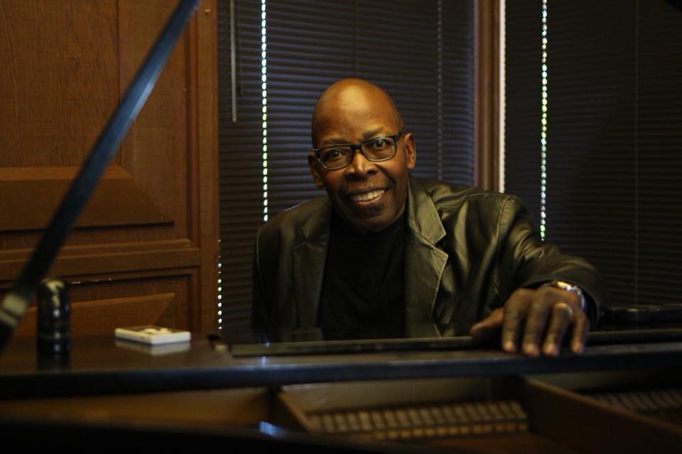REggie at Piano